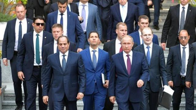 Hundreds of black-clothed bodyguards guarded Putin's high-profile ...